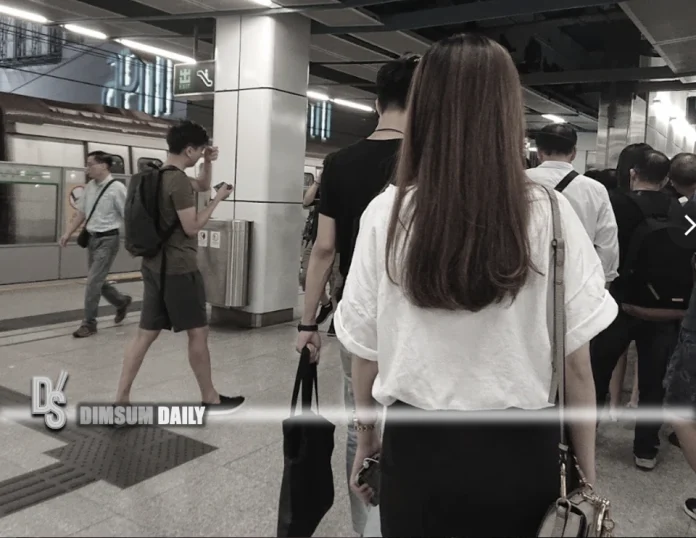MTR stations crowded as workers await train services after Typhoon ...