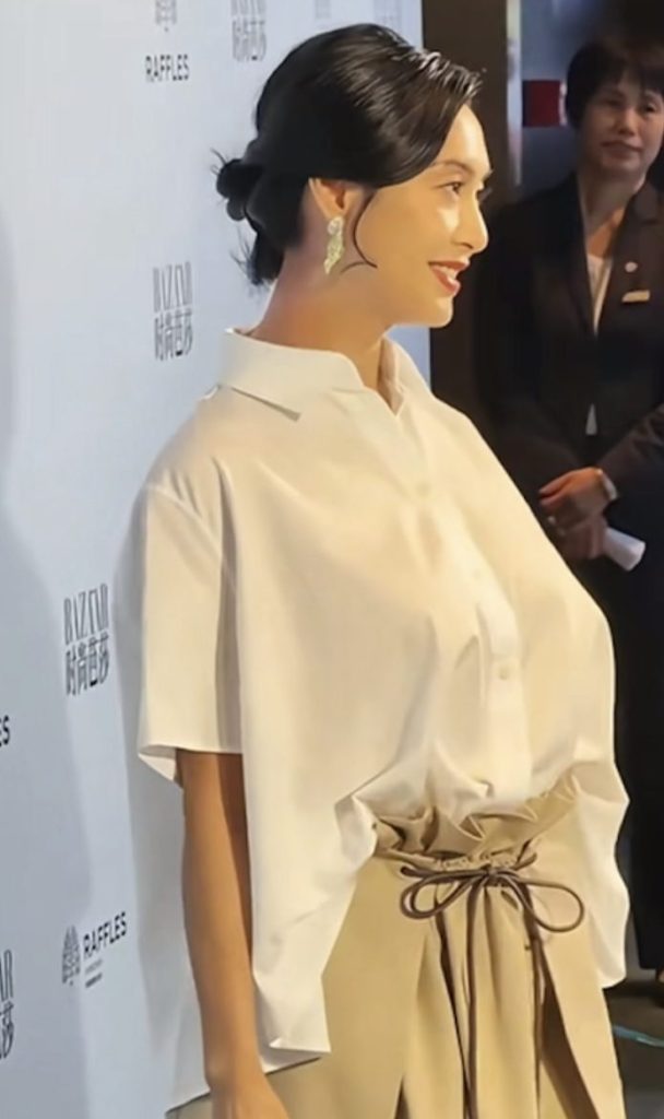 Retired actress Athena Chu's loose-fitting attire accentuates unusual ...