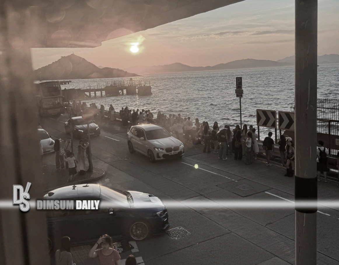 Chinese tourists disregard traffic as they crowd Kennedy Town New Praya ...