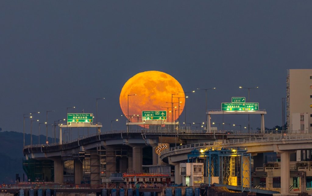 Photography enthusiasts witness rare moon phenomenon in Hong Kong