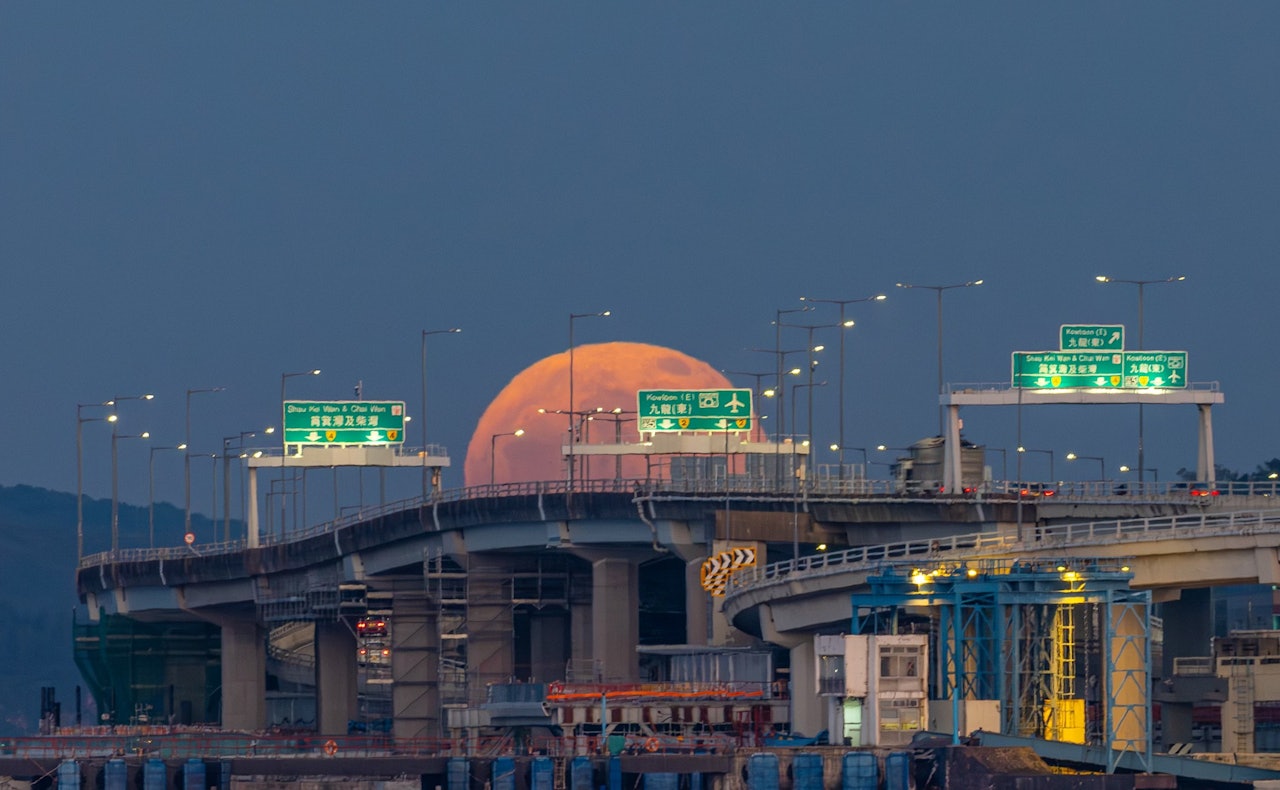 Photography enthusiasts witness rare moon phenomenon in Hong Kong