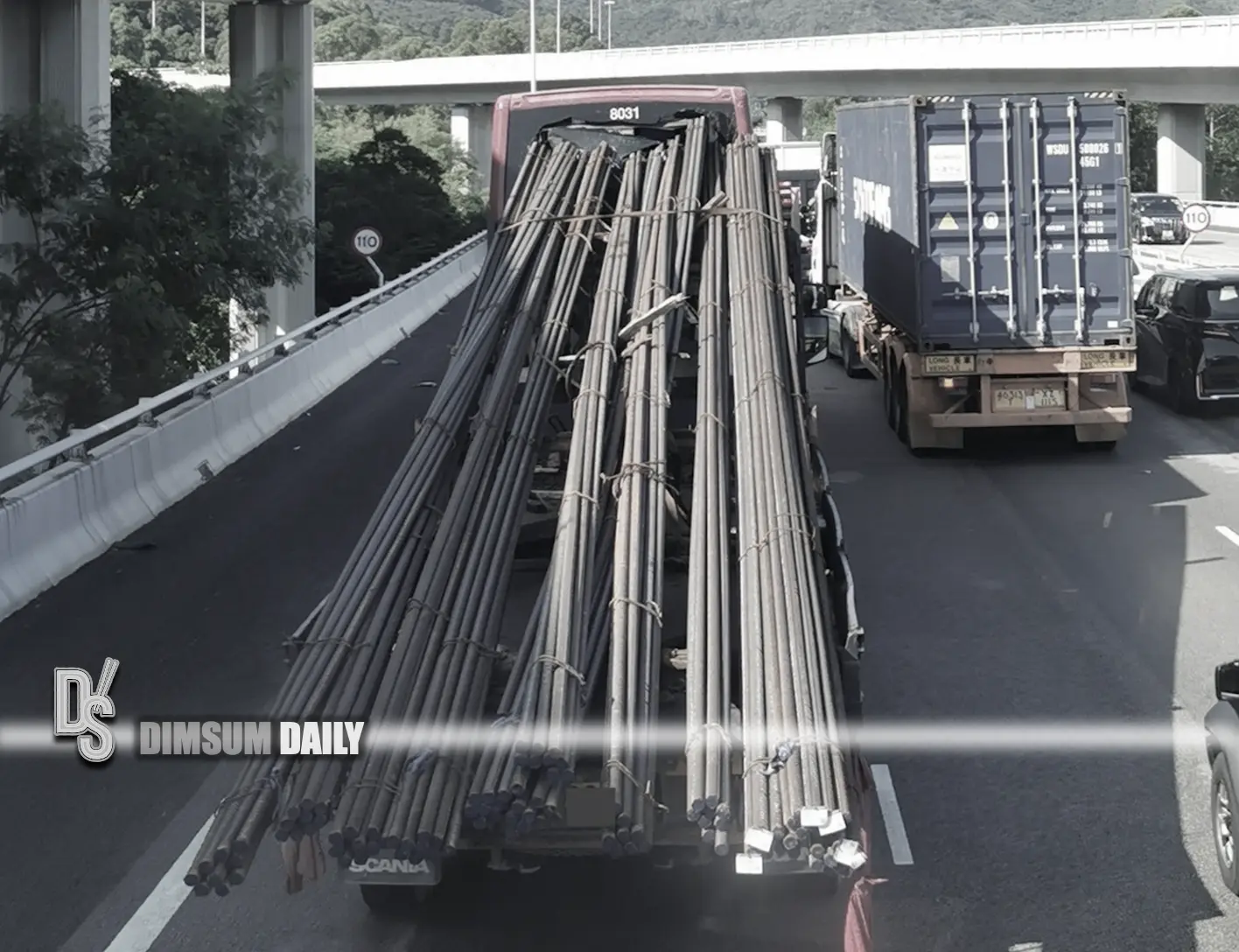 Steel rods from truck shatter rear window of bus on North Lantau Highway