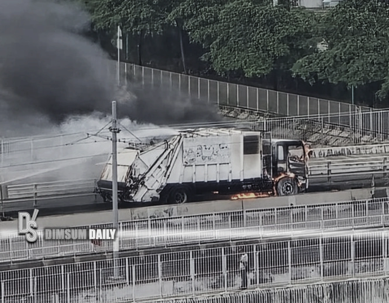 Paper scraps ignition causes garbage truck fire on Tuen Mun's Hoi Wong Road