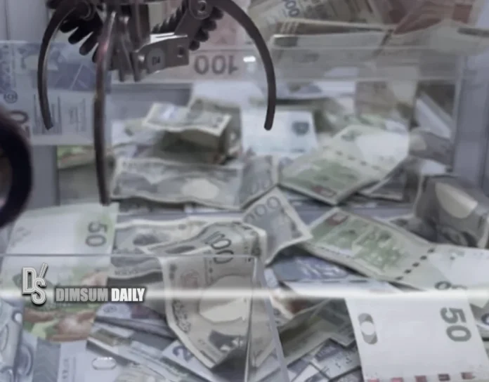 Hong Kong father uses “money claw” rewards to motivate son to study