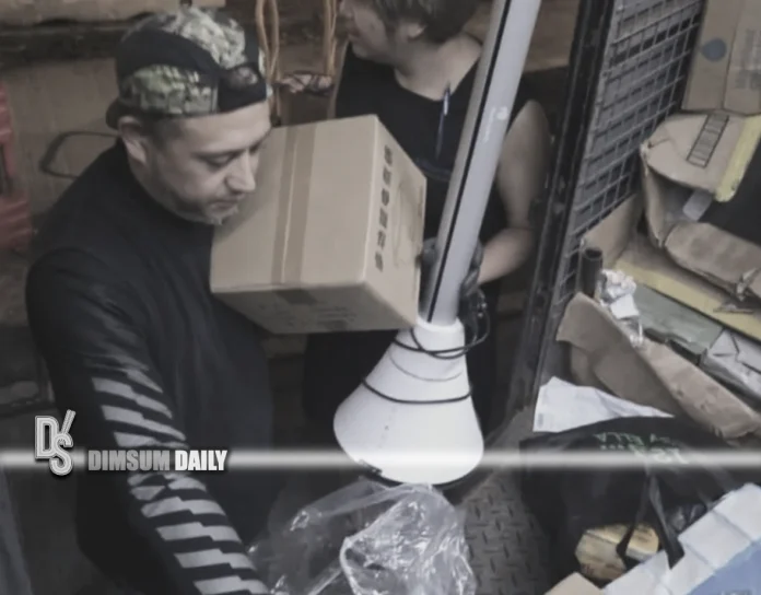 Steven Cheung helps move supplies to transitional housing after Wang ...