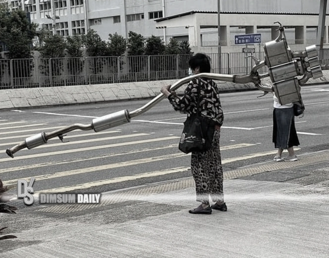 Middle‑aged woman praised for hefting car exhaust in Kwai Chung