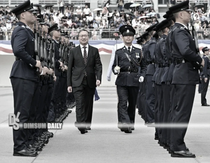 Secretary for Justice Paul Lam reviews police graduation parade