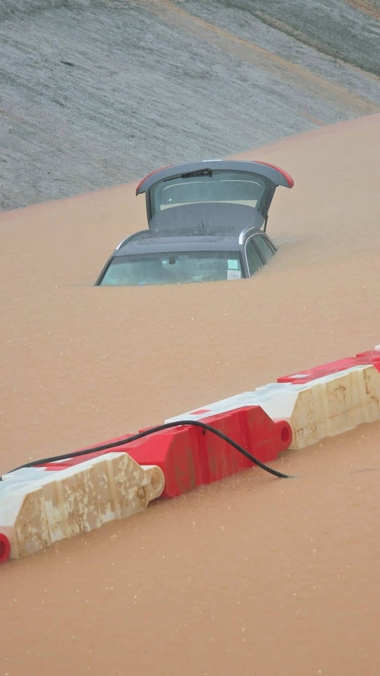 Female driver abandons car in flooded Tuen Mun road during Black Rainstorm