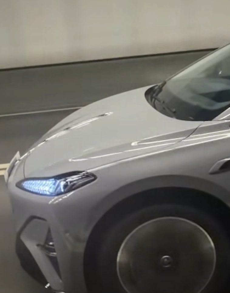Cross-border driver filmed using phone hands‑free at wheel while ...