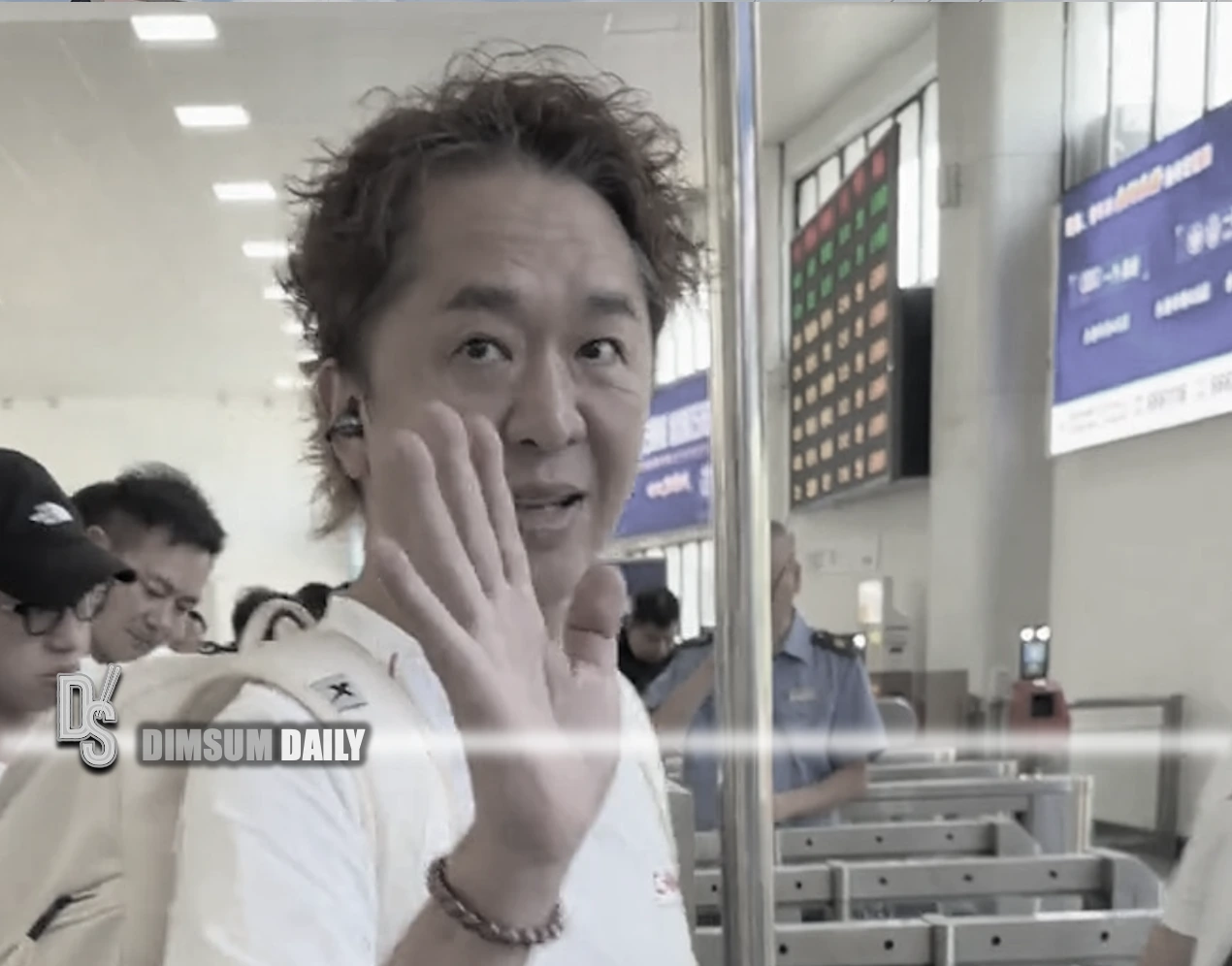 Former HK actor Johnny Tang queues for high‑speed rail